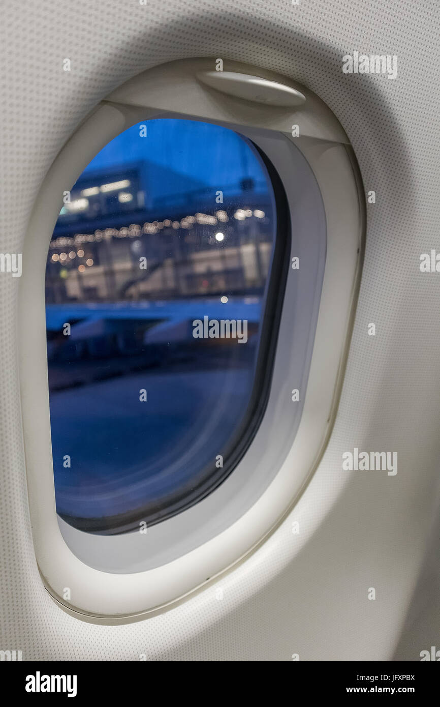 View through the airplane window to the passenger terminal of schiphol ...