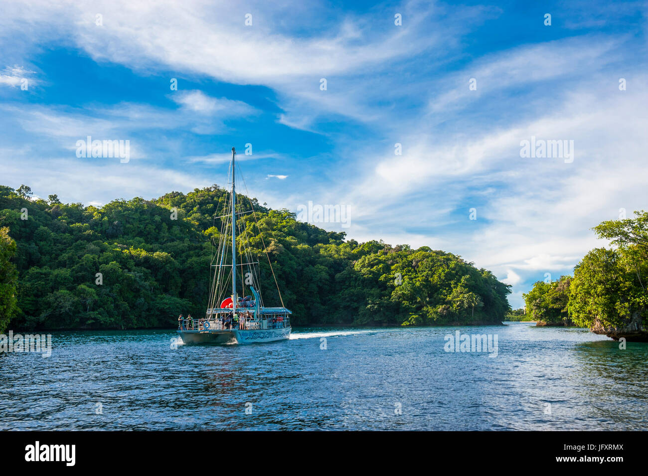 Sailing boat leaving th habrour of Koror, Rock islands, Palau, Central ...