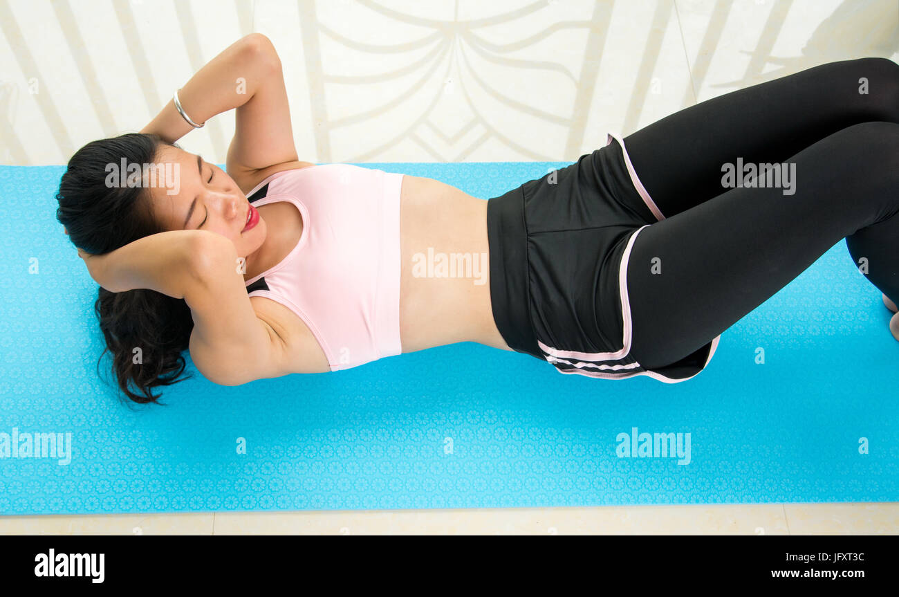 Woman Exercise Home Crunches Stock Photos & Woman Exercise Home ...