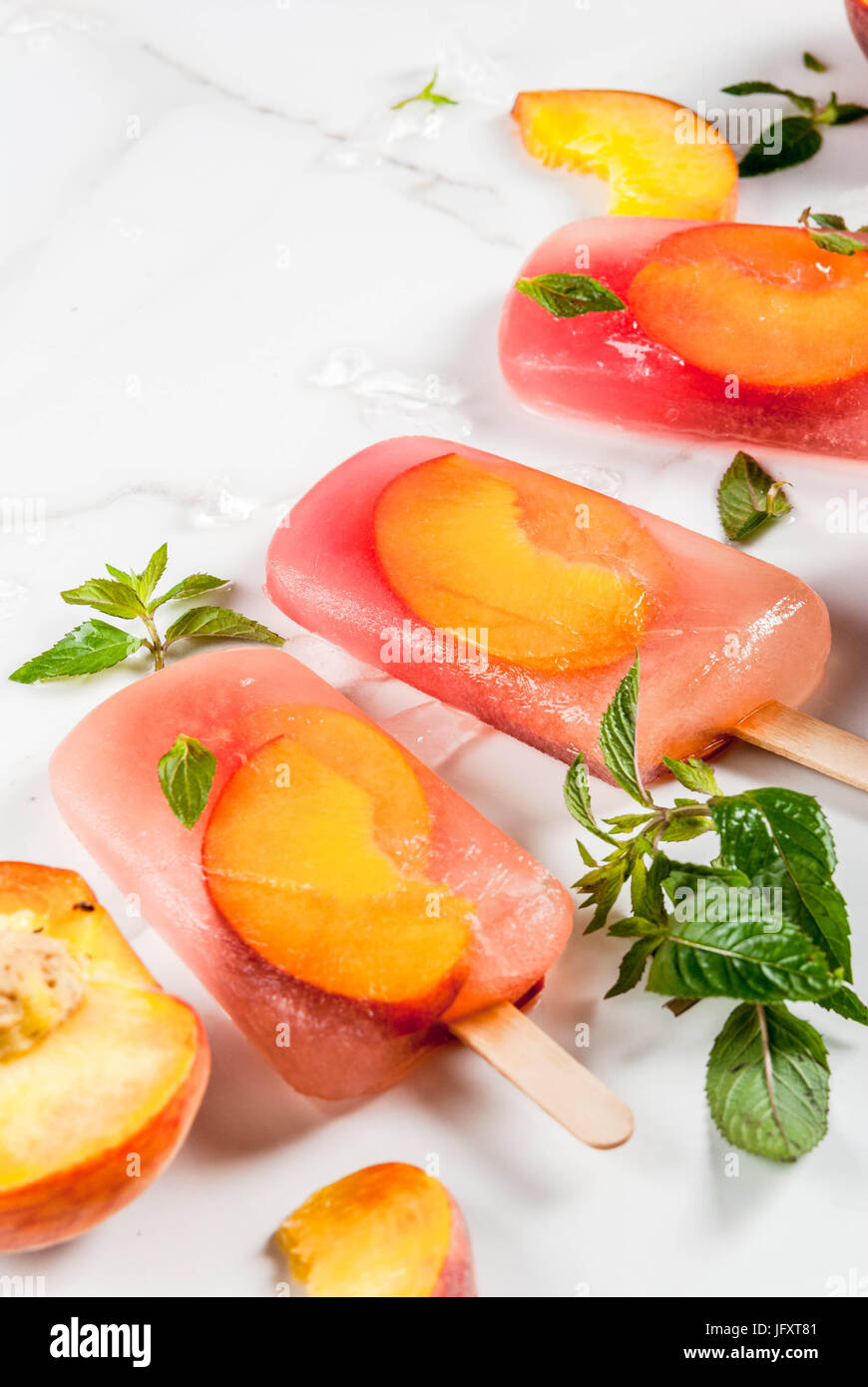Summer desserts. Frozen drinks. Sweet fruit popsicles from frozen peach ...