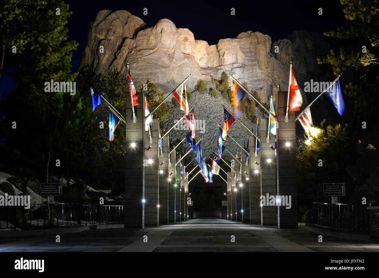 International flags line the Grand View Entrance to the Mount Rushmore ...
