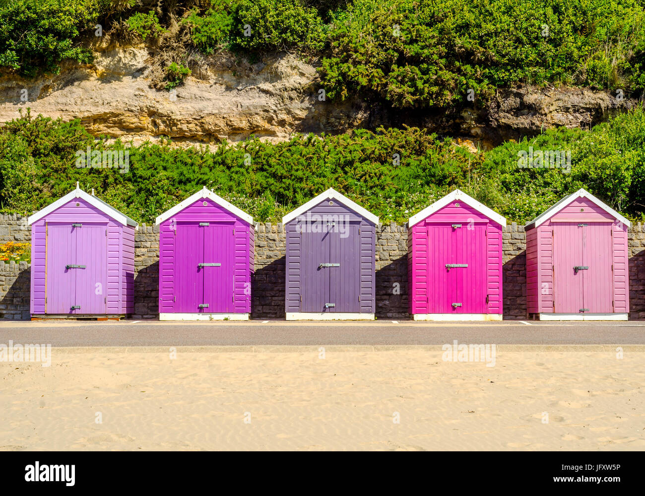 Colored houses on the beach, colorful door to summer cottages, seaside ...