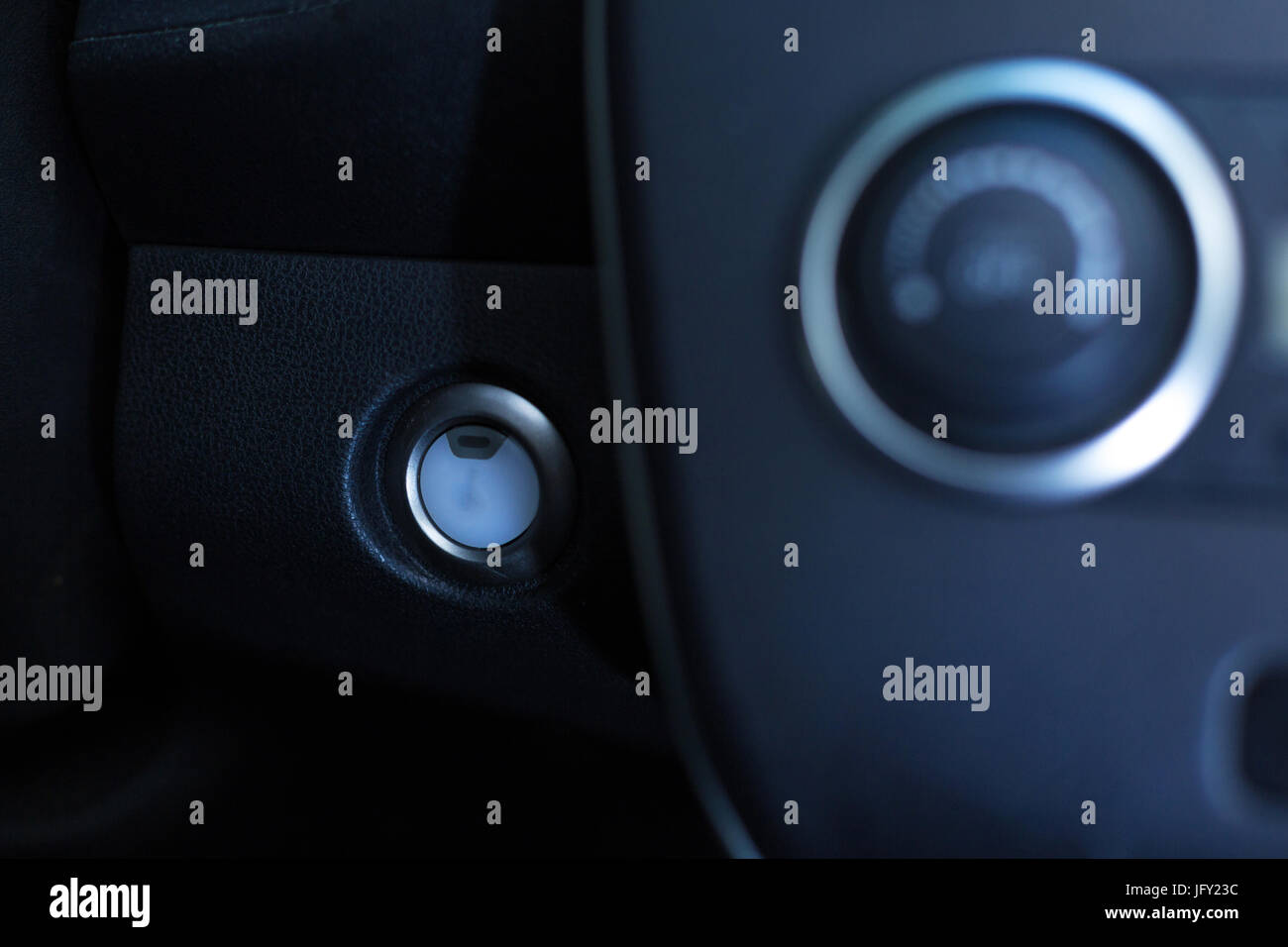 Power switch of a new car with leather lining Stock Photo - Alamy