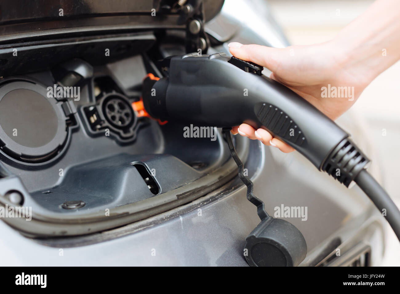 Close up of electrical nozzle for charging e-car Stock Photo - Alamy
