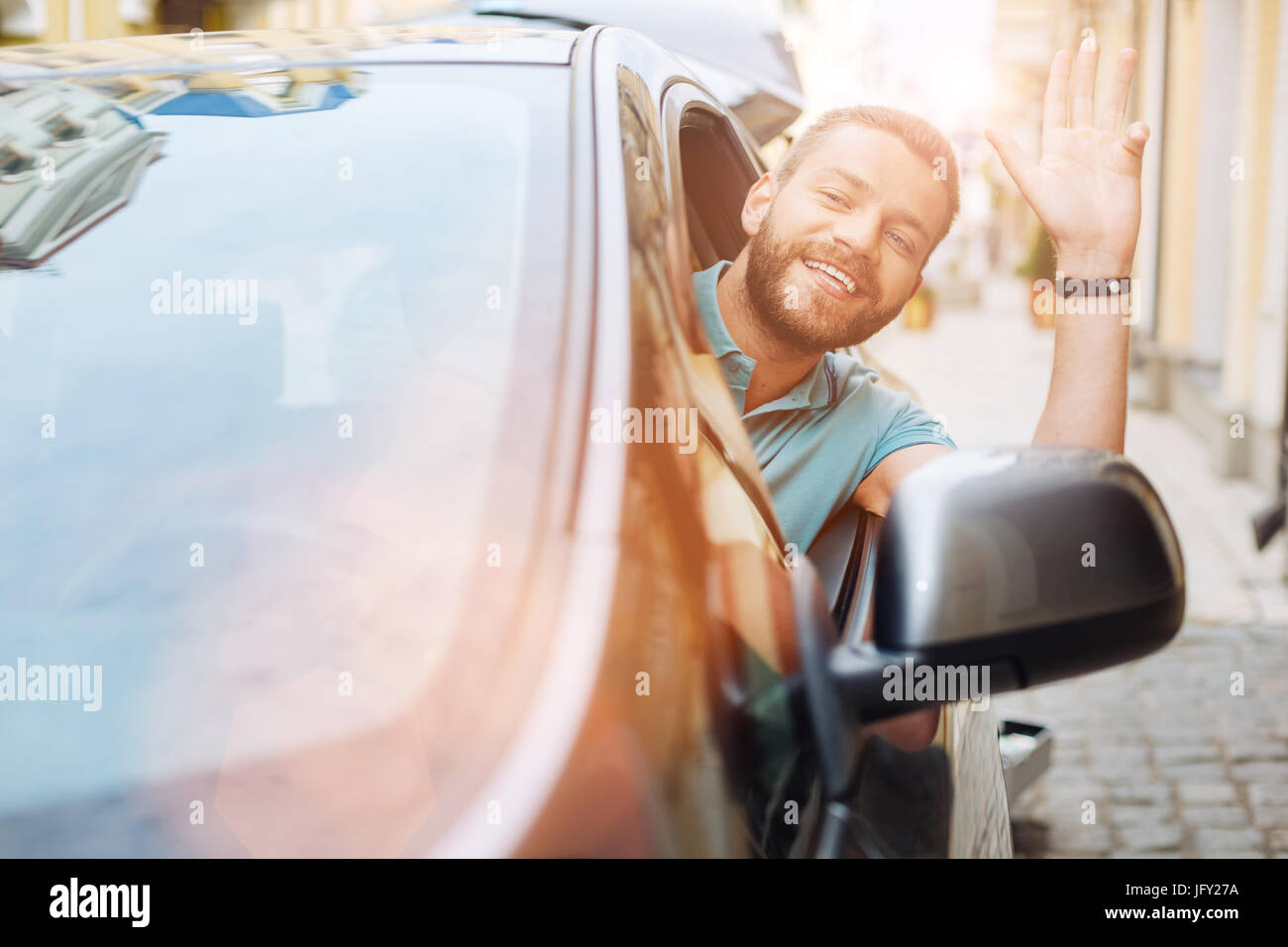 Man leaning out of car window hi-res stock photography and images - Alamy
