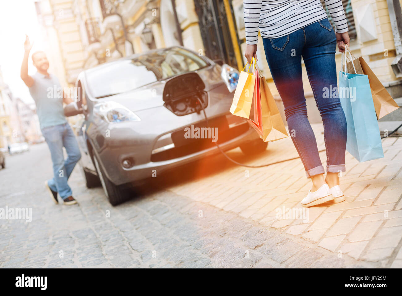 Young woman coming back from shopping Stock Photo - Alamy