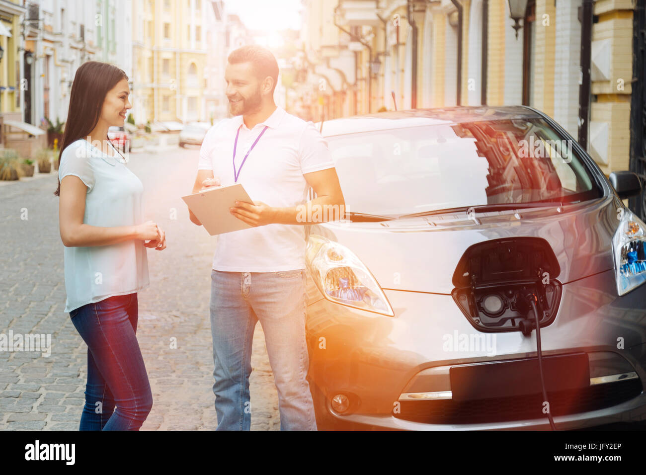 Charming woman providing her data for e-car rent Stock Photo - Alamy