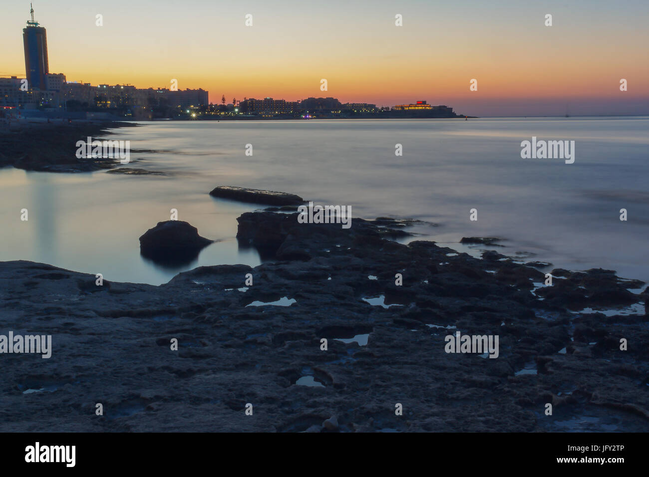A long exposure photograph of the waterfront in Silema, Malta. The ...