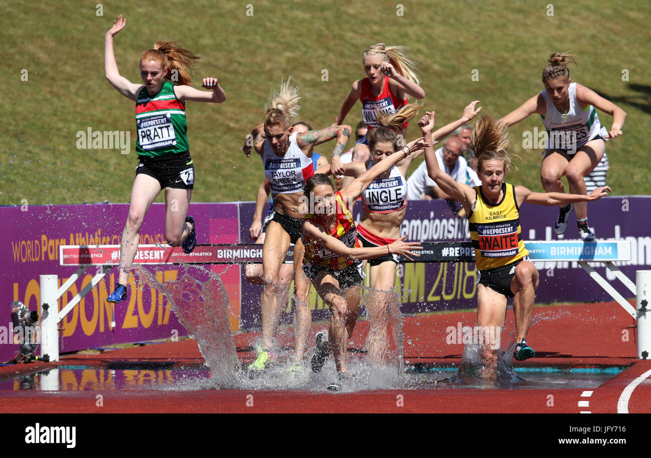 Iona Lake (centre) stumbles as she comes out of the water during the ...