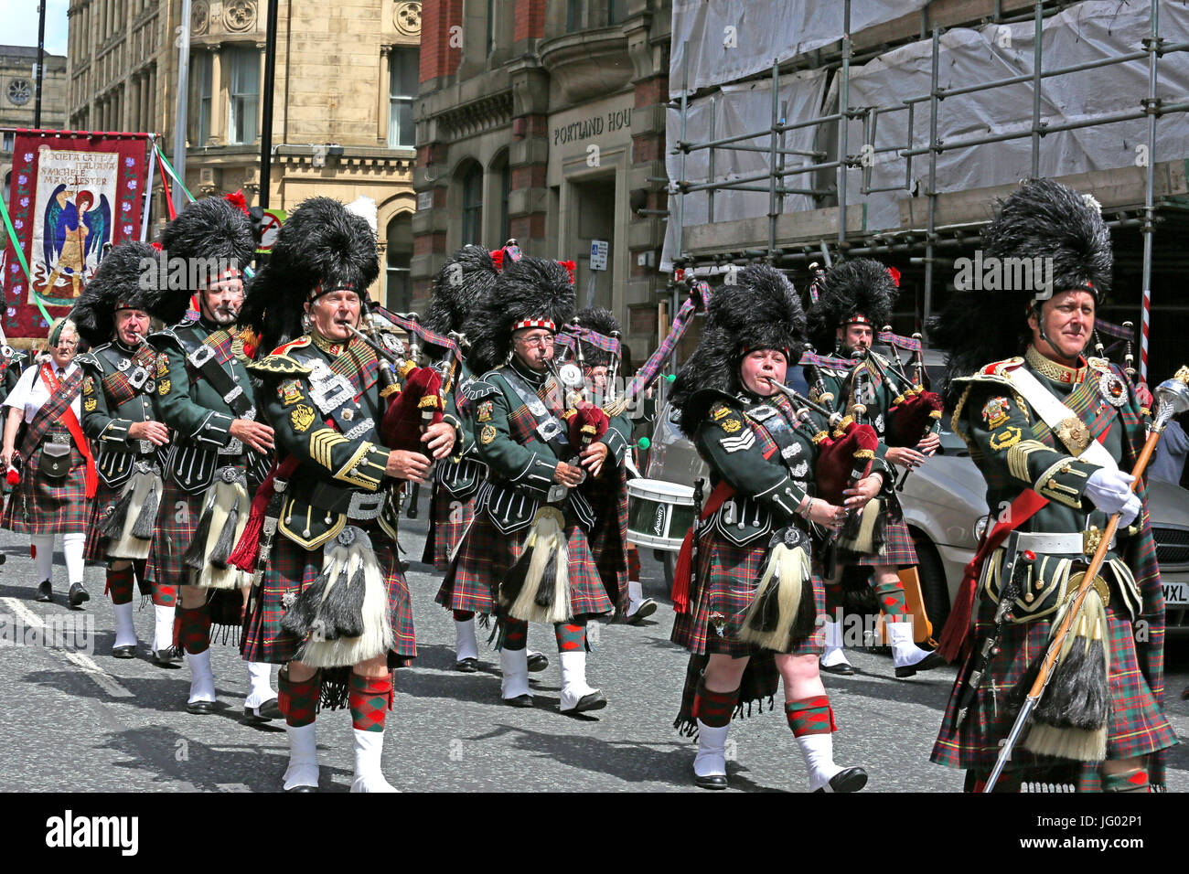 Manchester, UK. 2nd July, 2017. . A marching pipe band on the Madonna ...