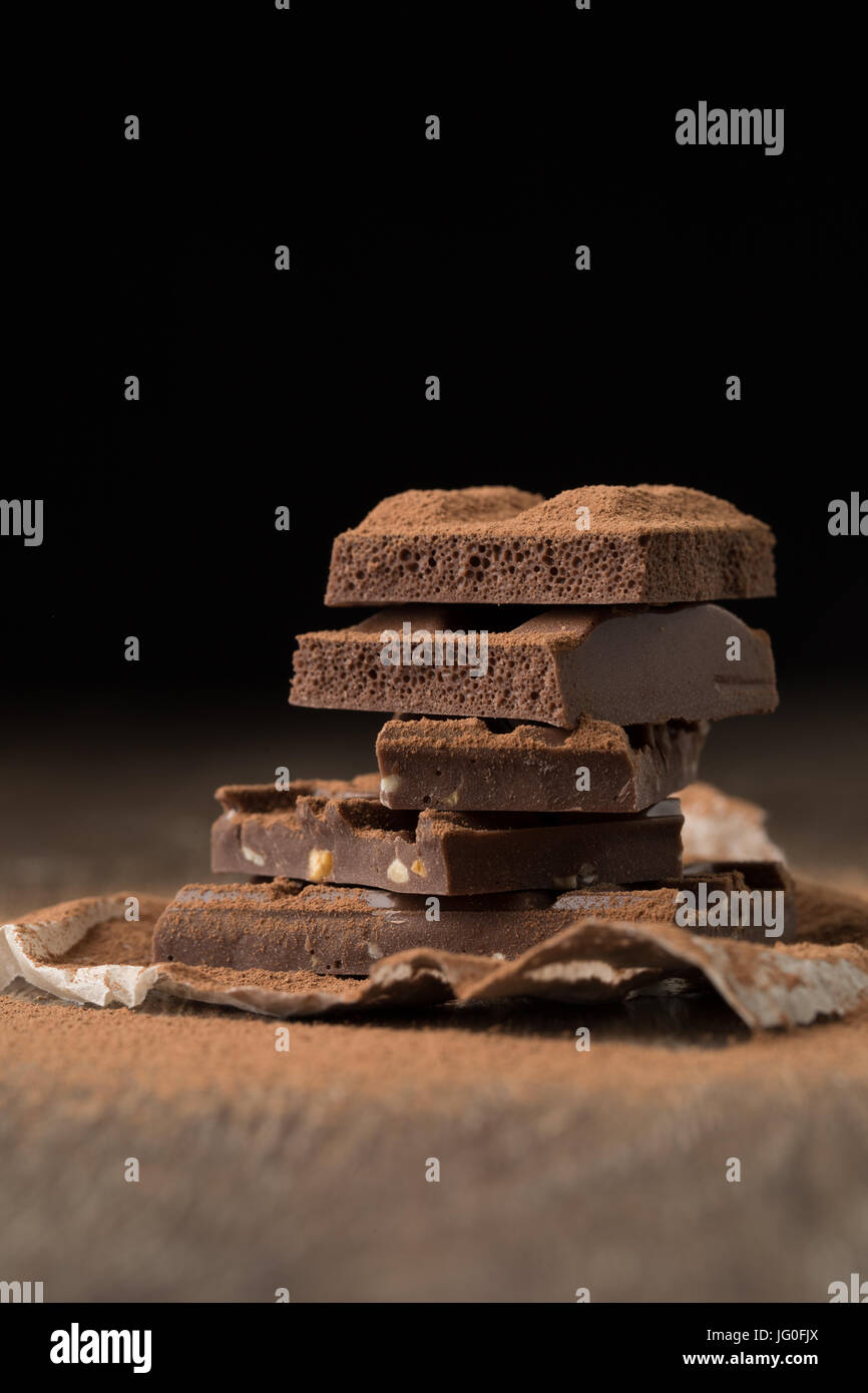 Pieces of chocolate on paper Stock Photo - Alamy