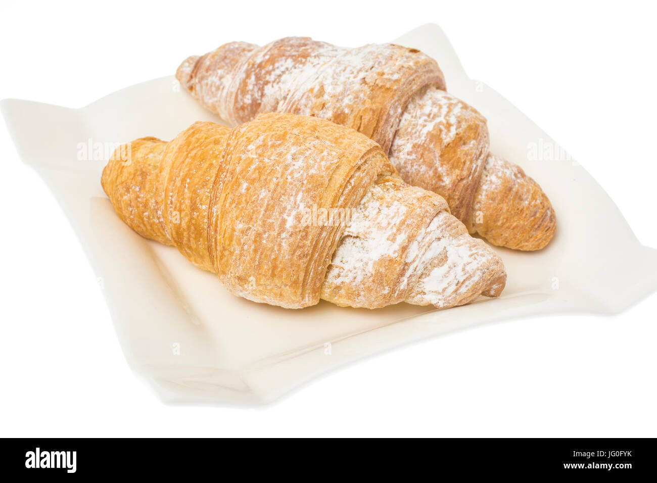 Two croissants on plate on white background. Studio Photo Stock Photo ...