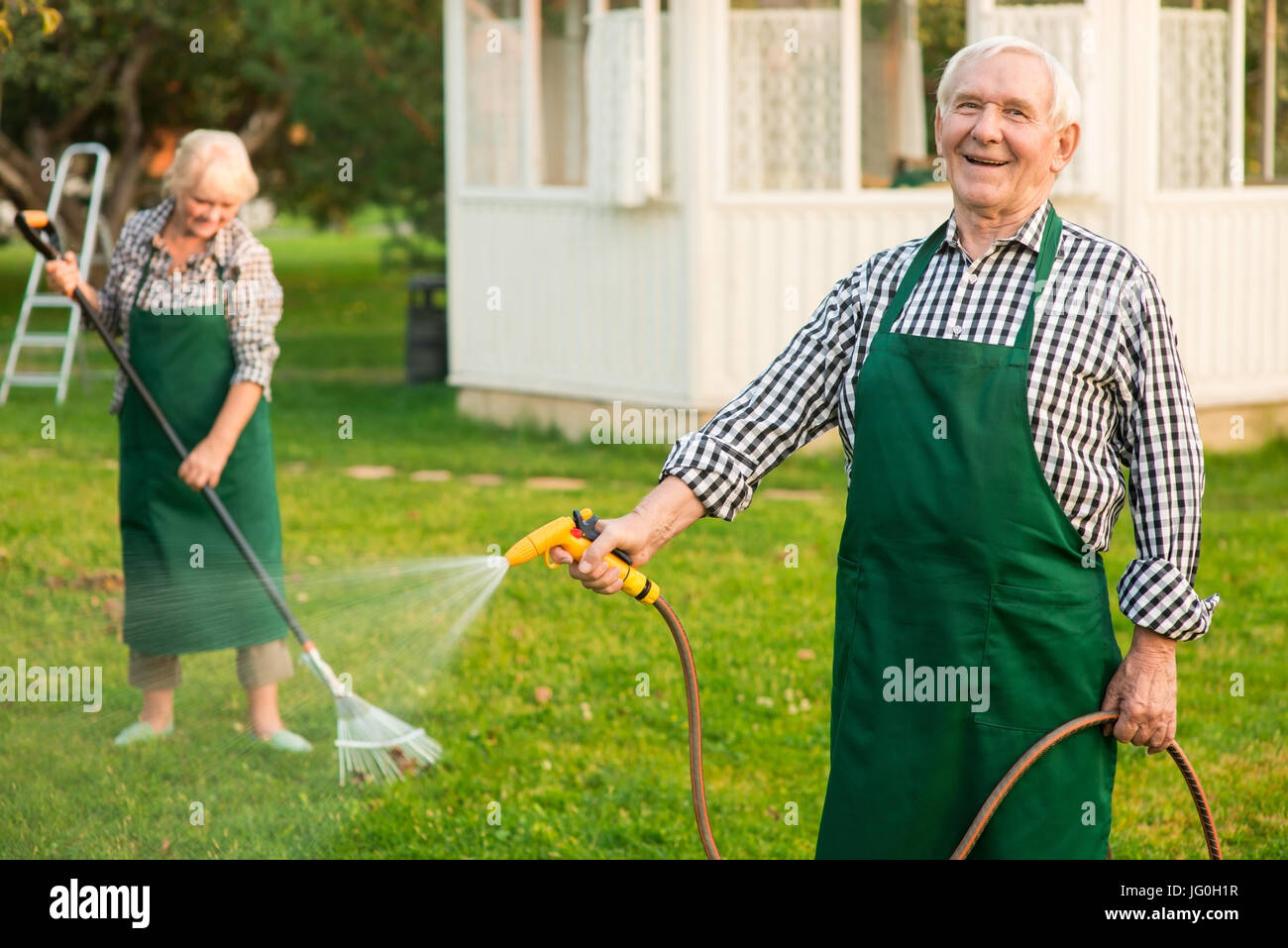 Man hose home hi-res stock photography and images - Alamy
