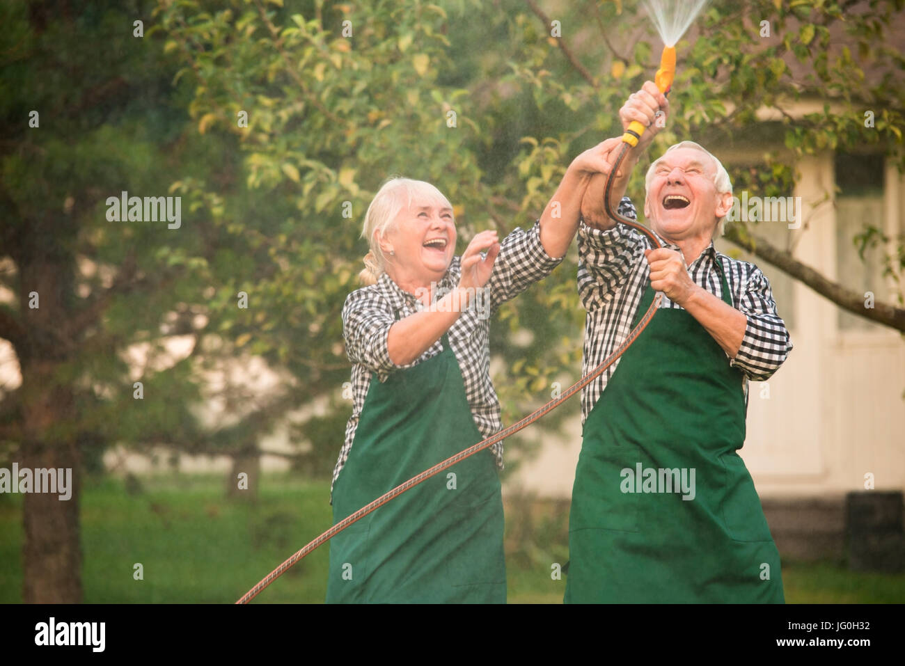 People having fun in garden Stock Photo - Alamy