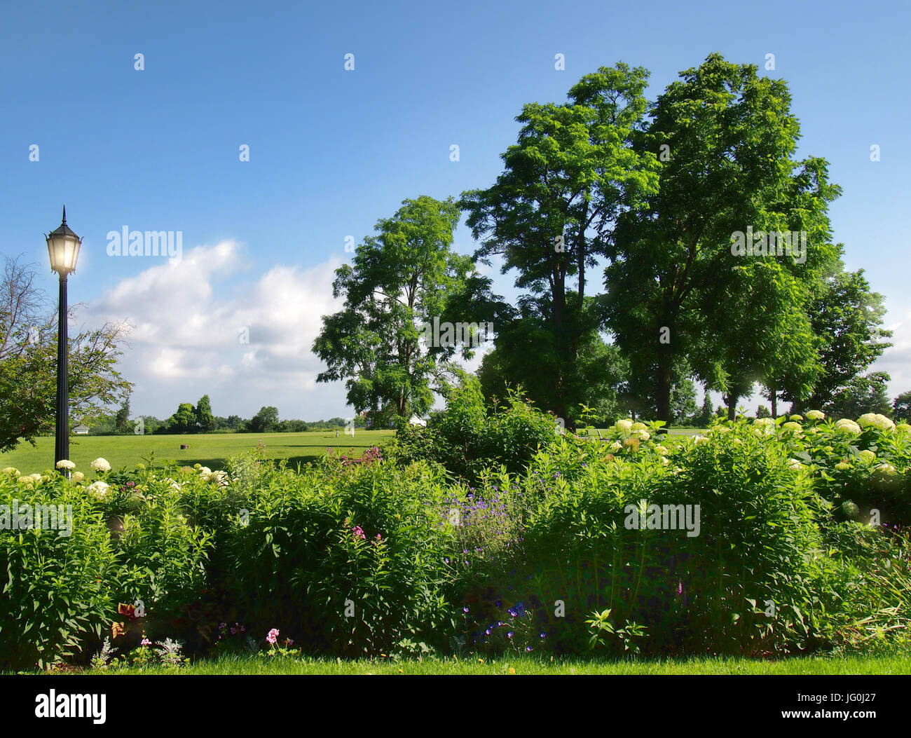 beautiful mansion yard with farmland in the distance Stock Photo - Alamy