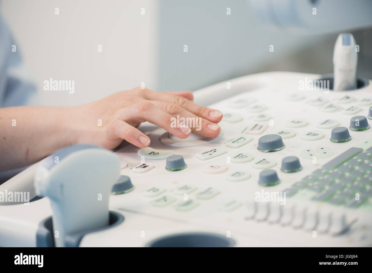 Hands on an ultrasound machine at modern clinic Stock Photo - Alamy