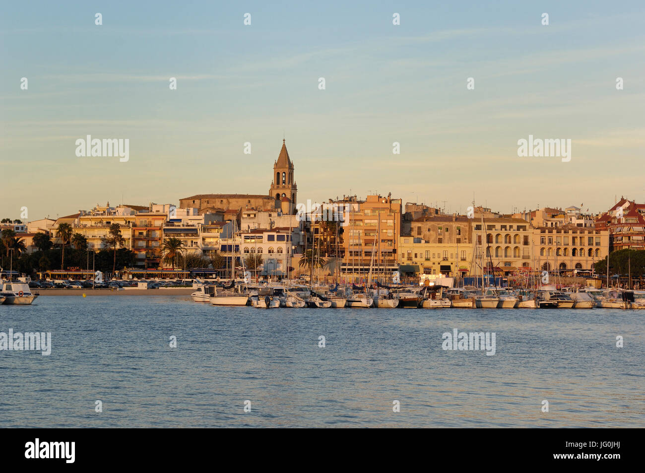 Sunset at the fishing port and village of Palamos, Girona, Catalonia ...