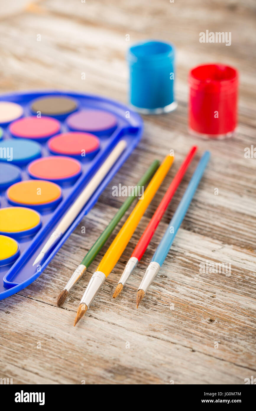 special painting tools on wooden background, education tools for ...