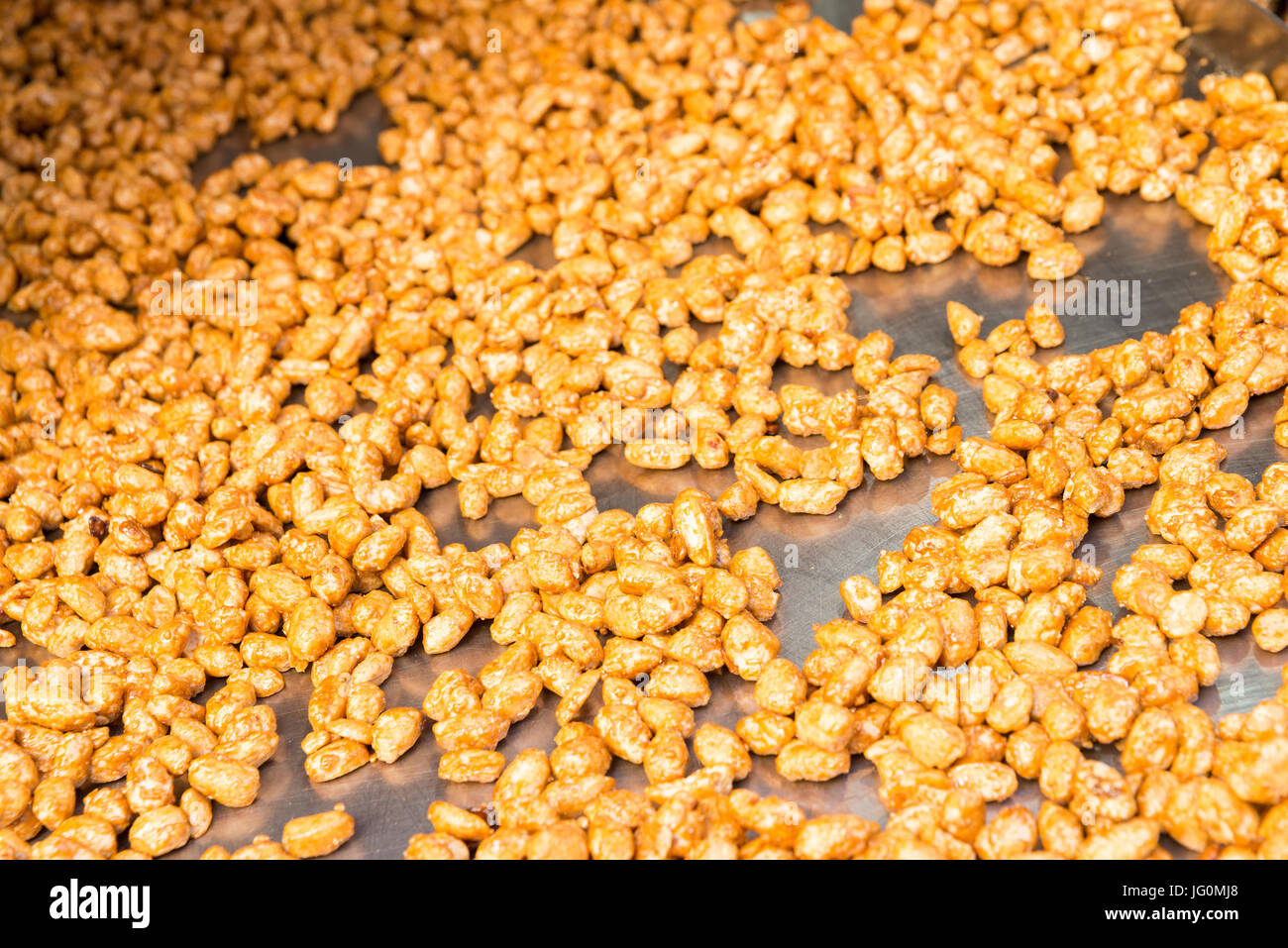 Delicious sugared peanuts ready for eat Stock Photo - Alamy