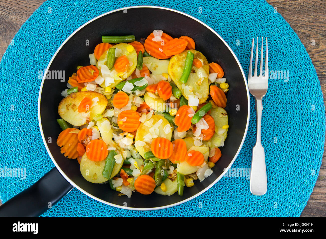 Food without meat:fried vegetables in frying pan. Studio Photo Stock ...