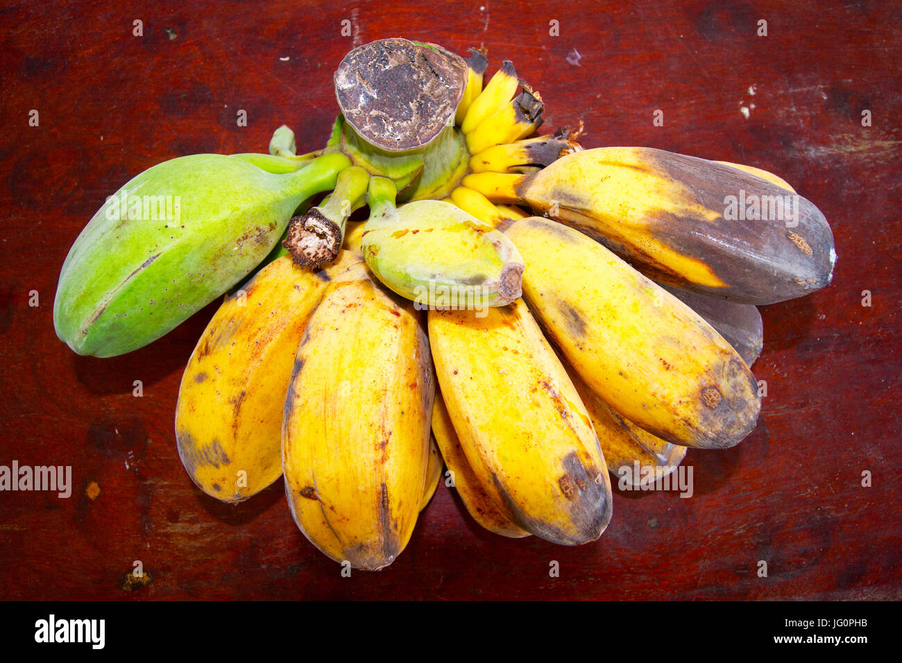 Banana ripen on wooden floor Stock Photo - Alamy