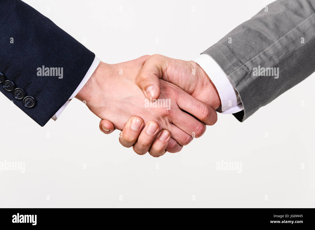 Two business men handshaking Stock Photo - Alamy