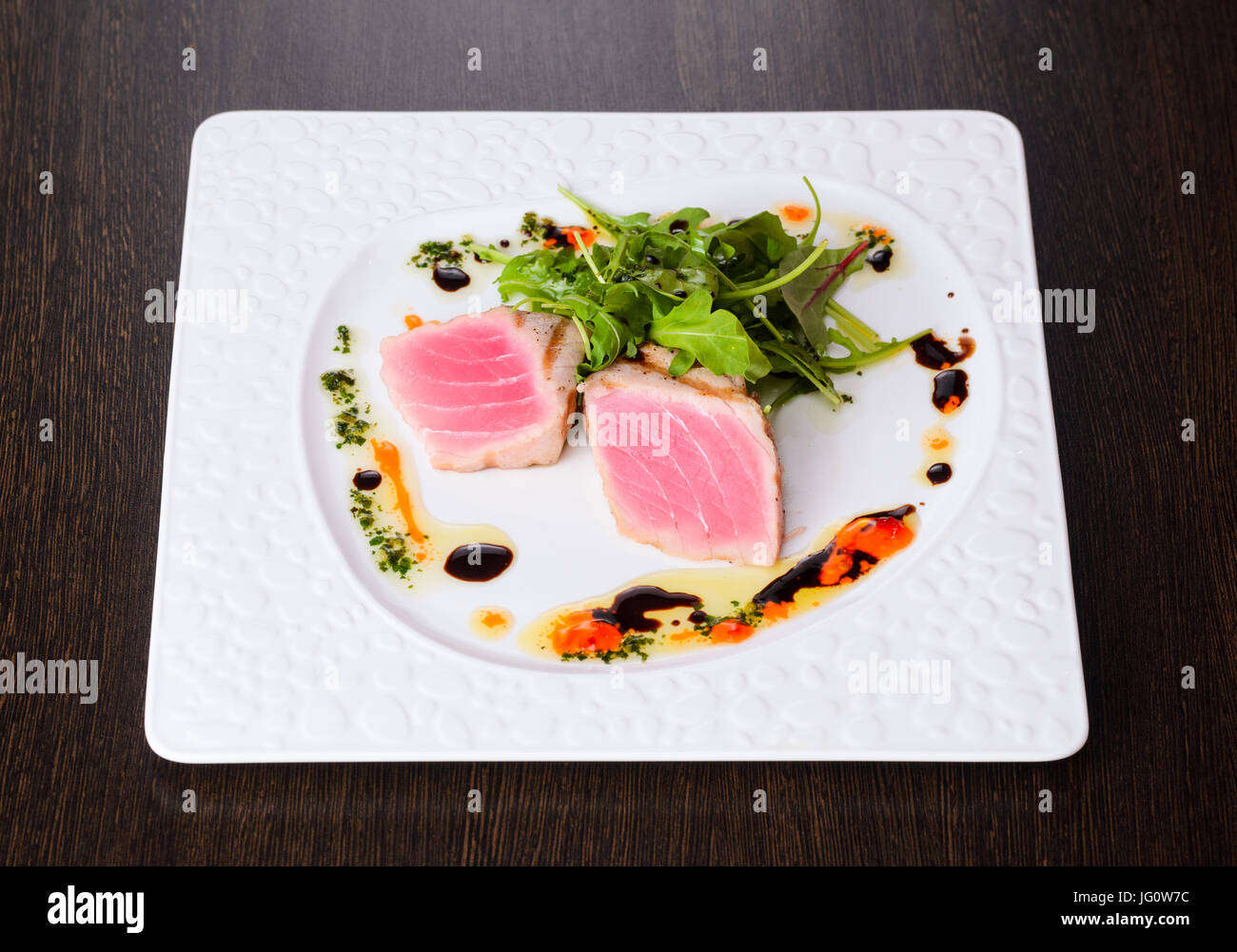 Tuna with salad on plate Stock Photo - Alamy