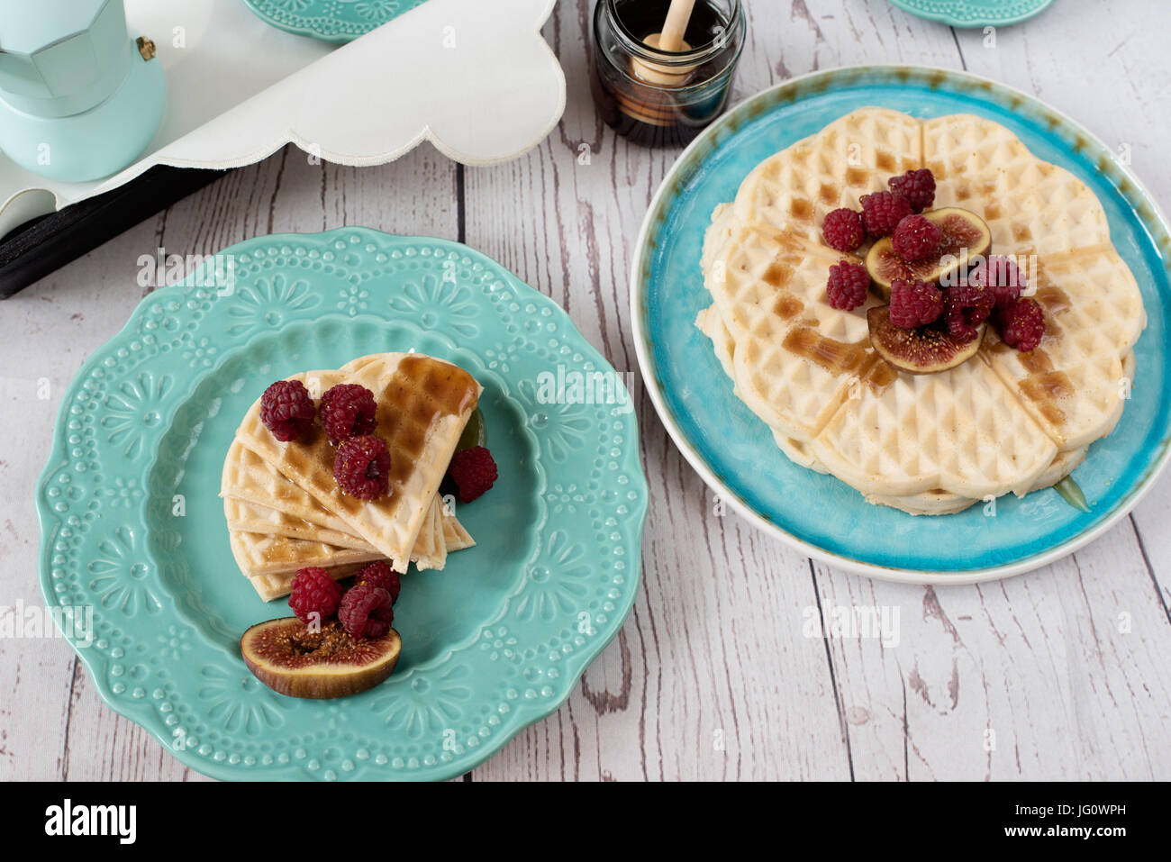 Soft Belgian heart shaped waffles with raspberries and figs, covered ...
