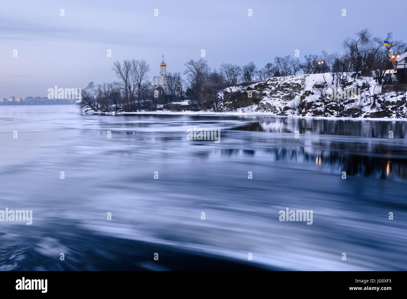 Aerial view of the great river with floating ice floes during the dusk ...