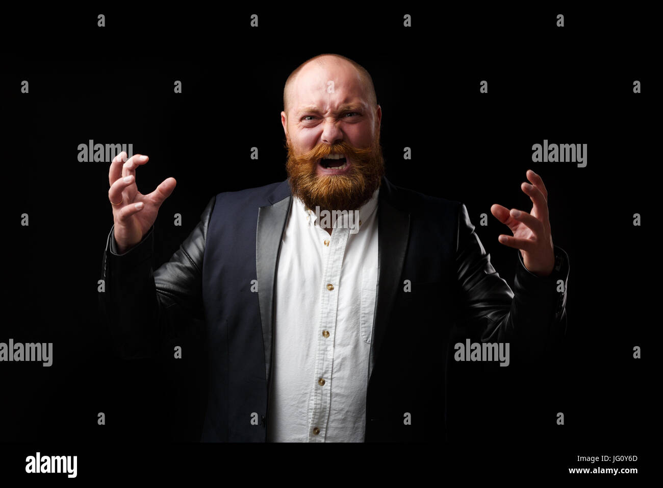 Screaming man with tense hands with ginger beard and mustache on empty ...
