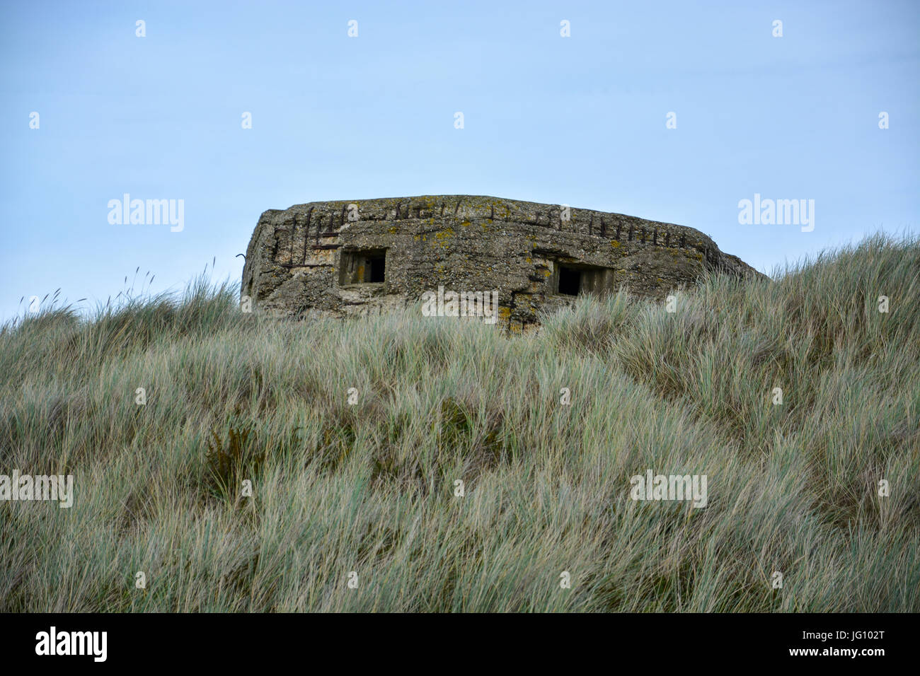 An old stone bunker with grass at a beach in Norfolk, England Stock ...