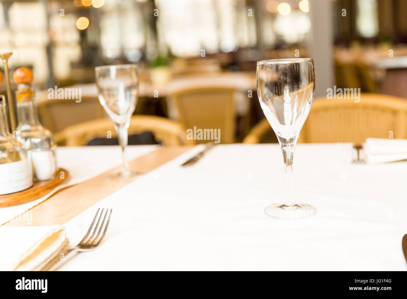 Empty glasses set in restaurant Stock Photo - Alamy