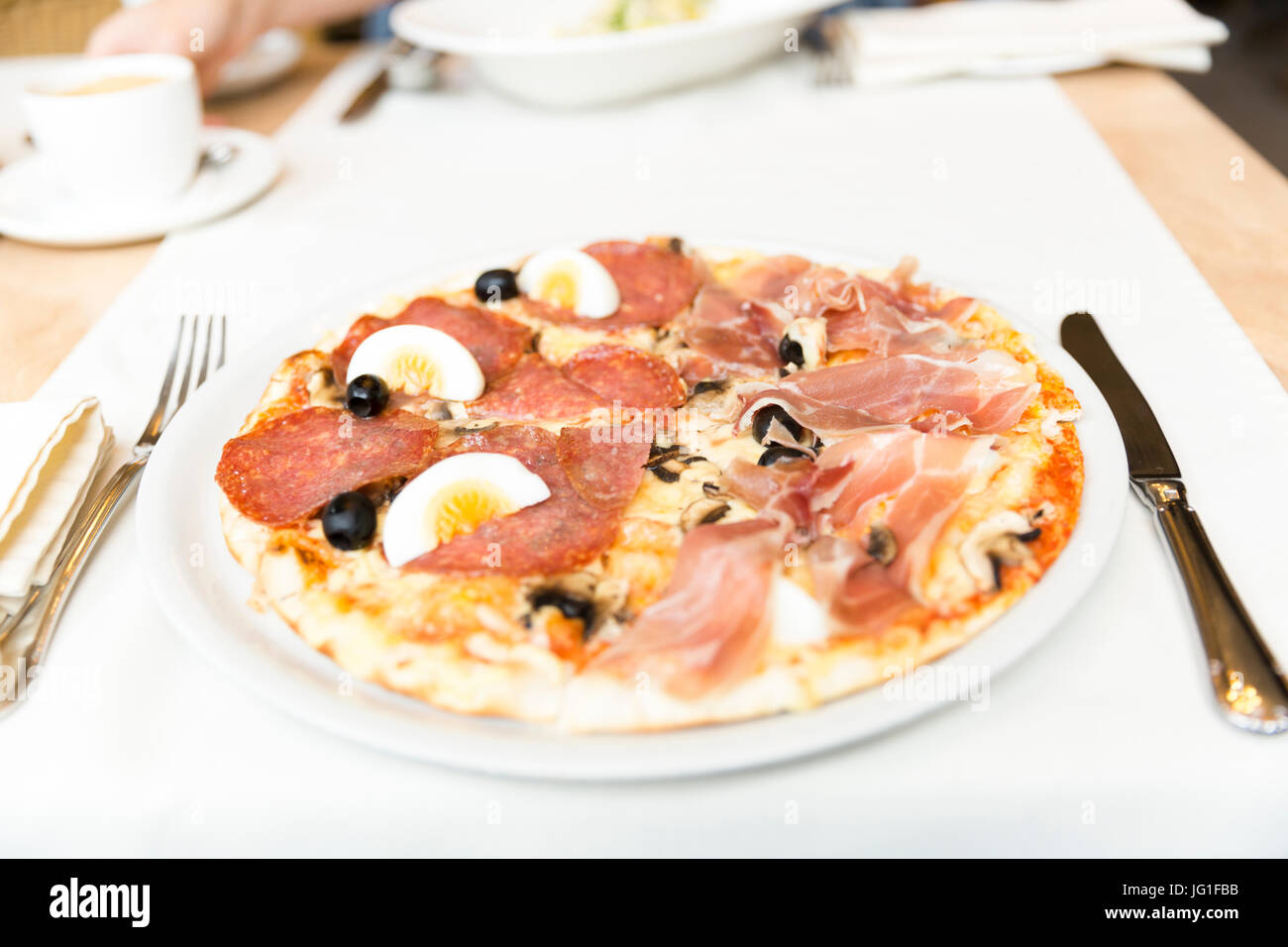 Pizza dish at fancy restaurant Stock Photo - Alamy