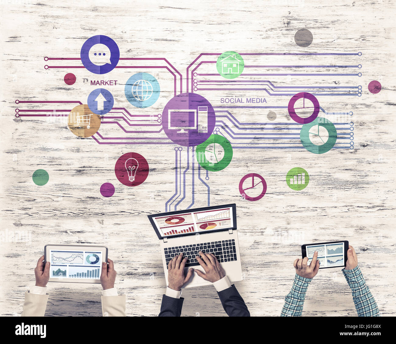 Group of three people with devices in hands working together as symbol ...