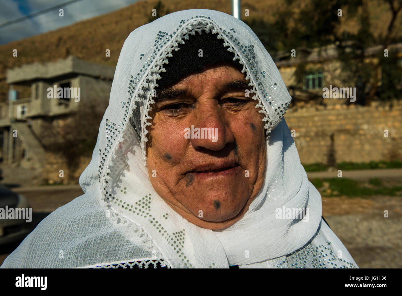Traditional dressed Kurdish woman in Ahmedawa on the border of Iran ...