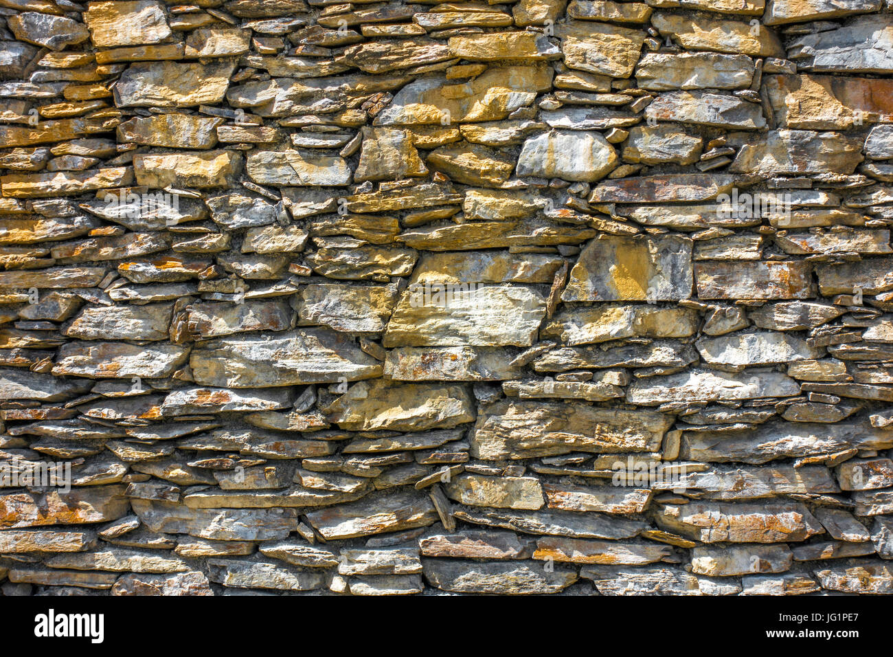 Structure of a natural stone wall Stock Photo - Alamy
