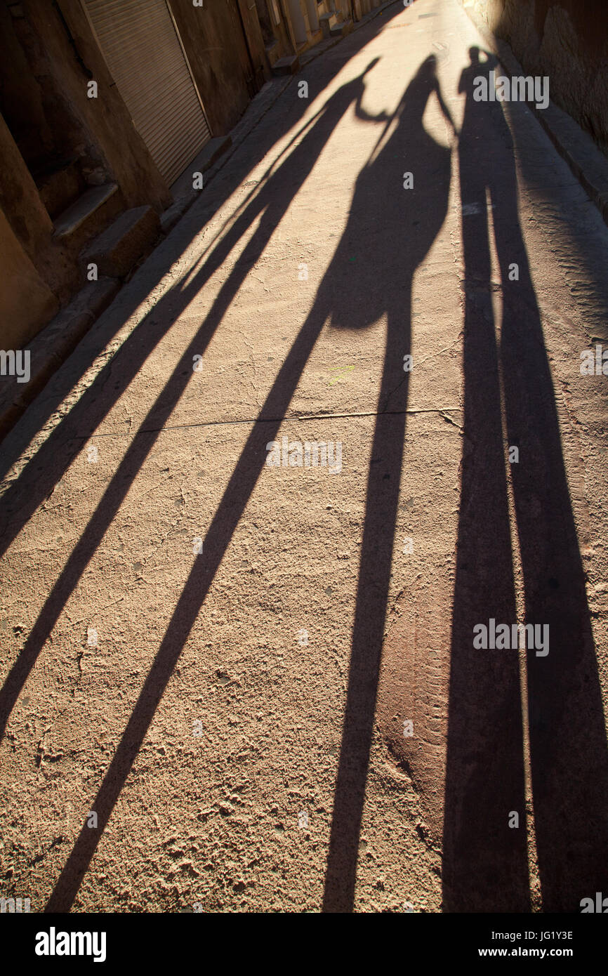 Three Shadows Holding Hands High Resolution Stock Photography and ...