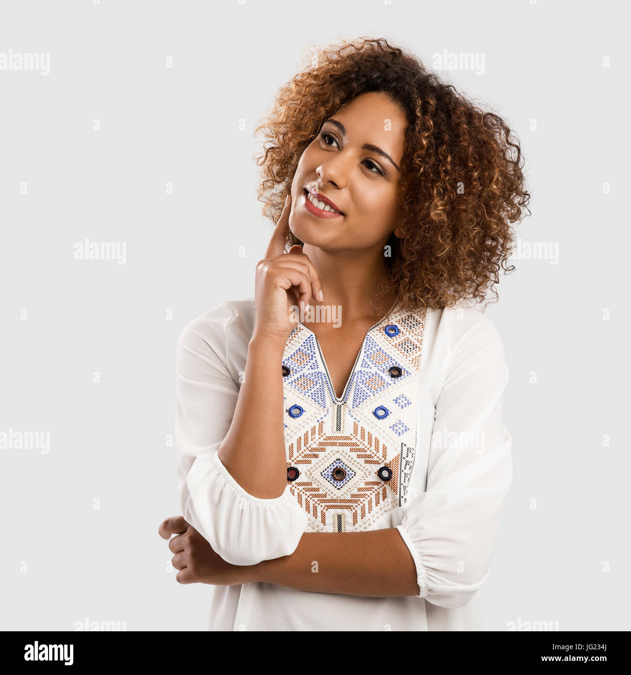 Beautiful African American woman thinking on something Stock Photo - Alamy
