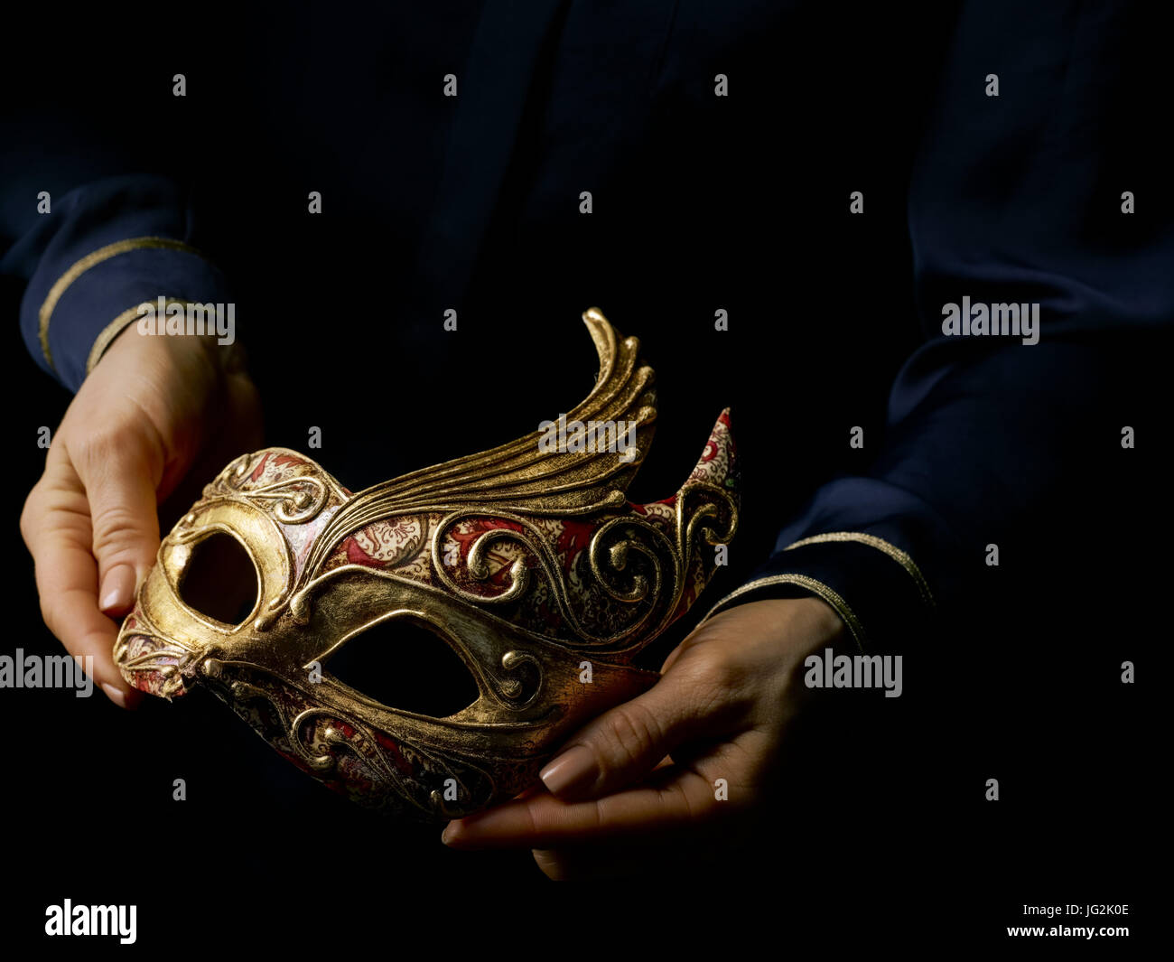 Black Mania. woman hands isolated on black showing Venetian mask Stock ...