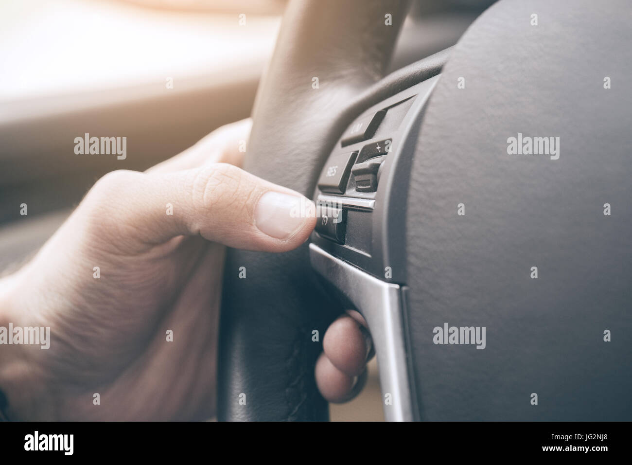 Young business person test drive new vehicle push button Stock Photo ...