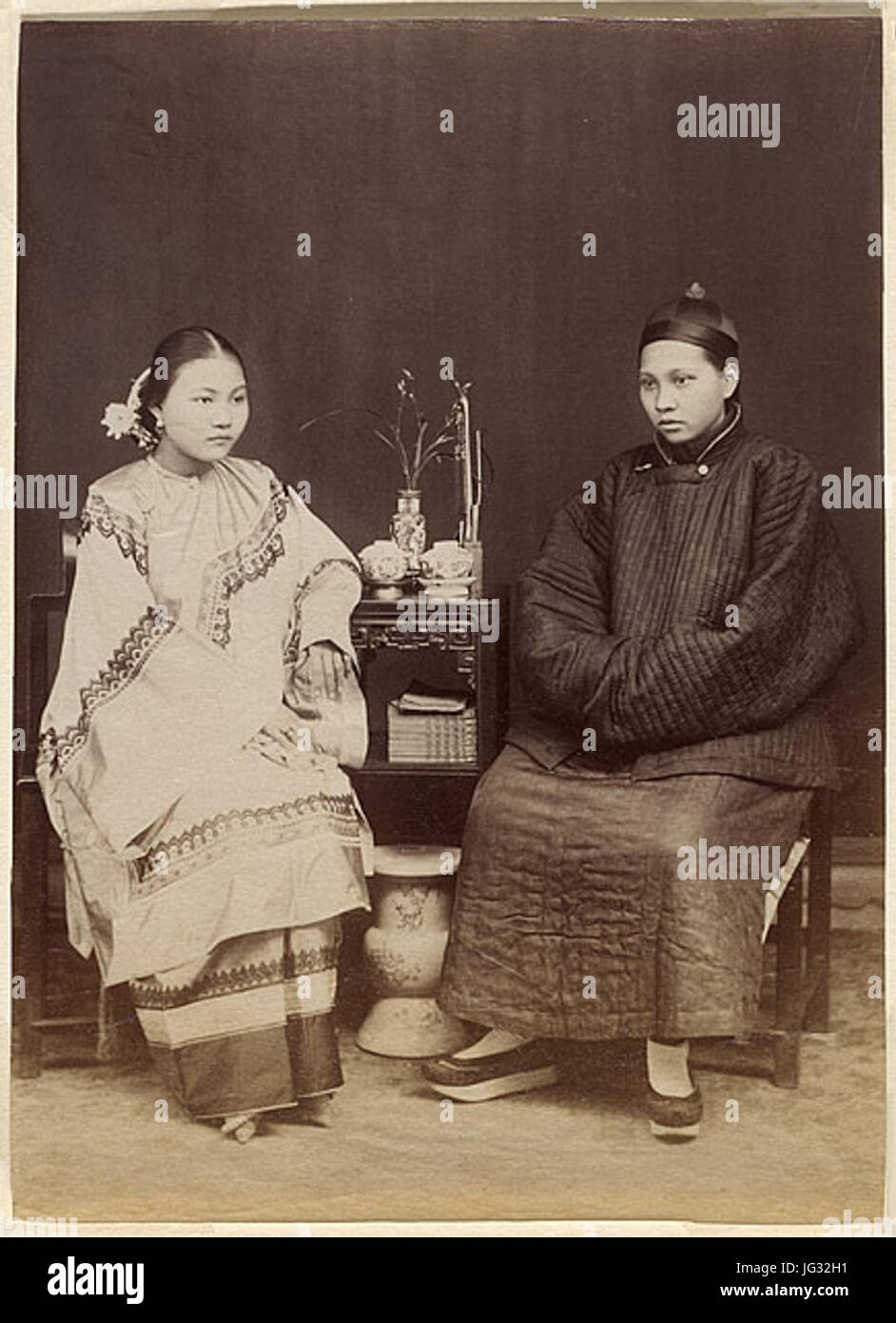 Lai Afong two Chinese women in studio one in scholar robes c1885 Stock ...