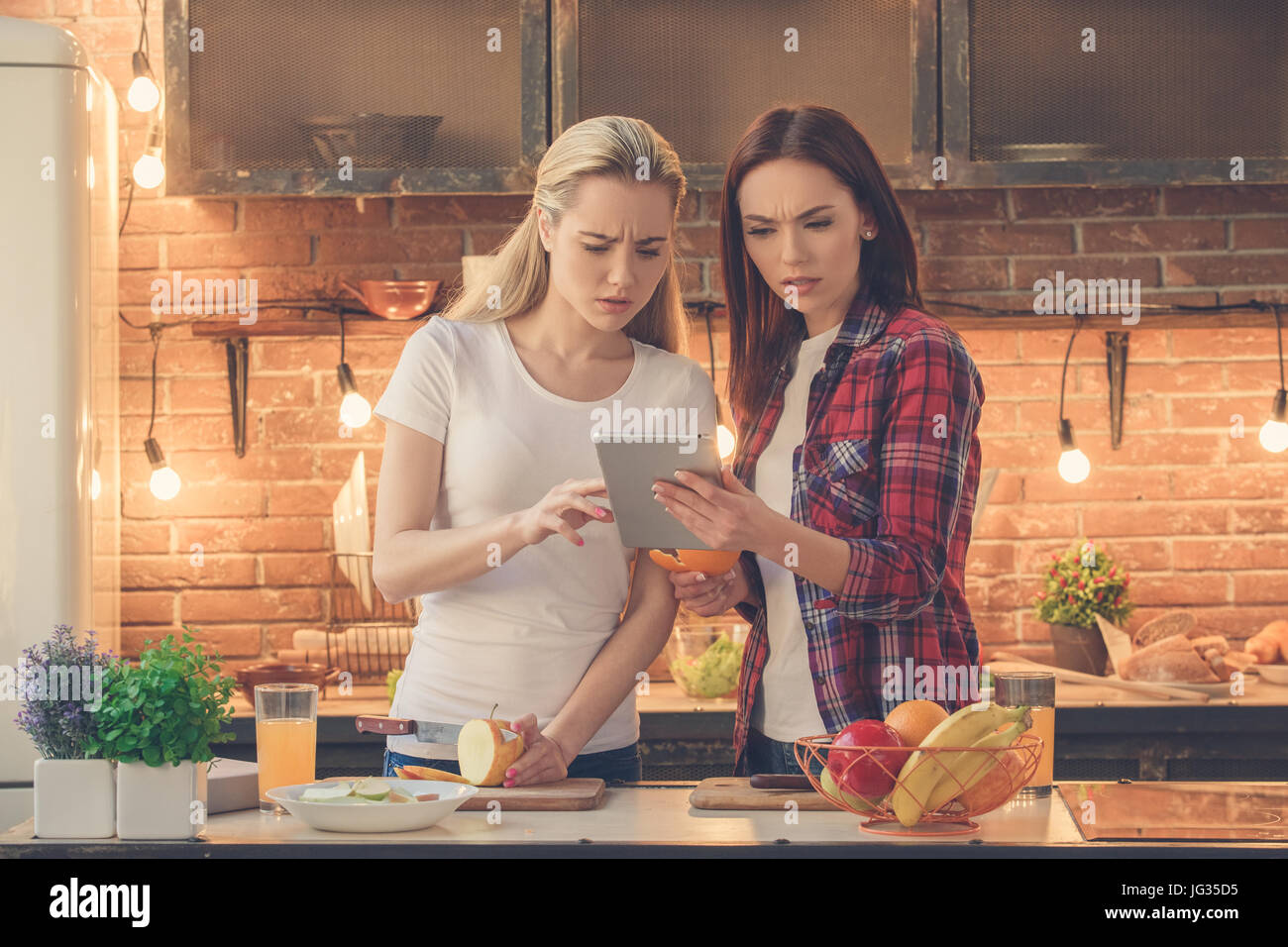 Women using fruits cooking hi-res stock photography and images - Alamy