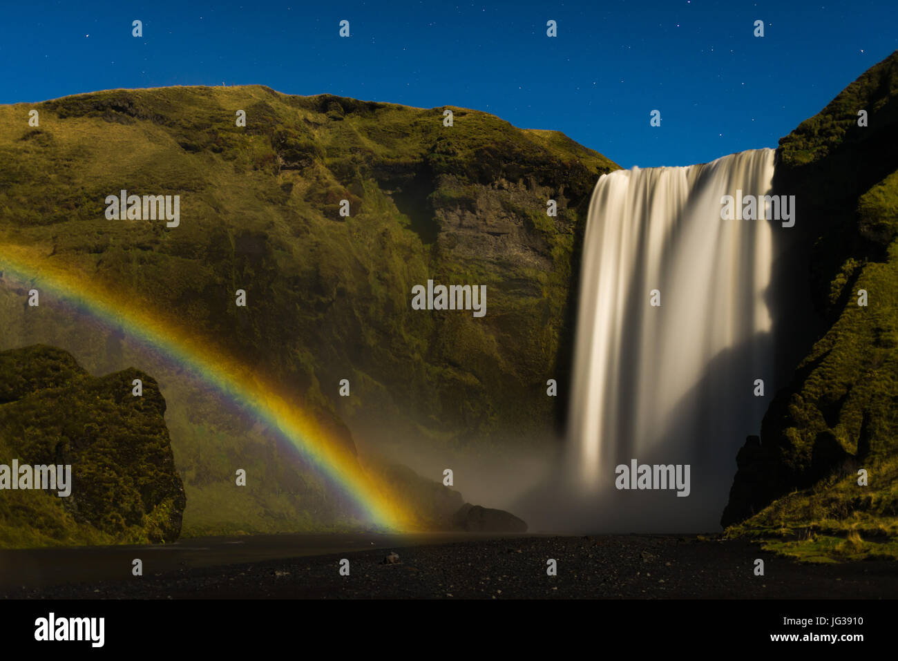 Skogafoss Waterfall At Night Lit By Moonlight Creating A Moonbow ...