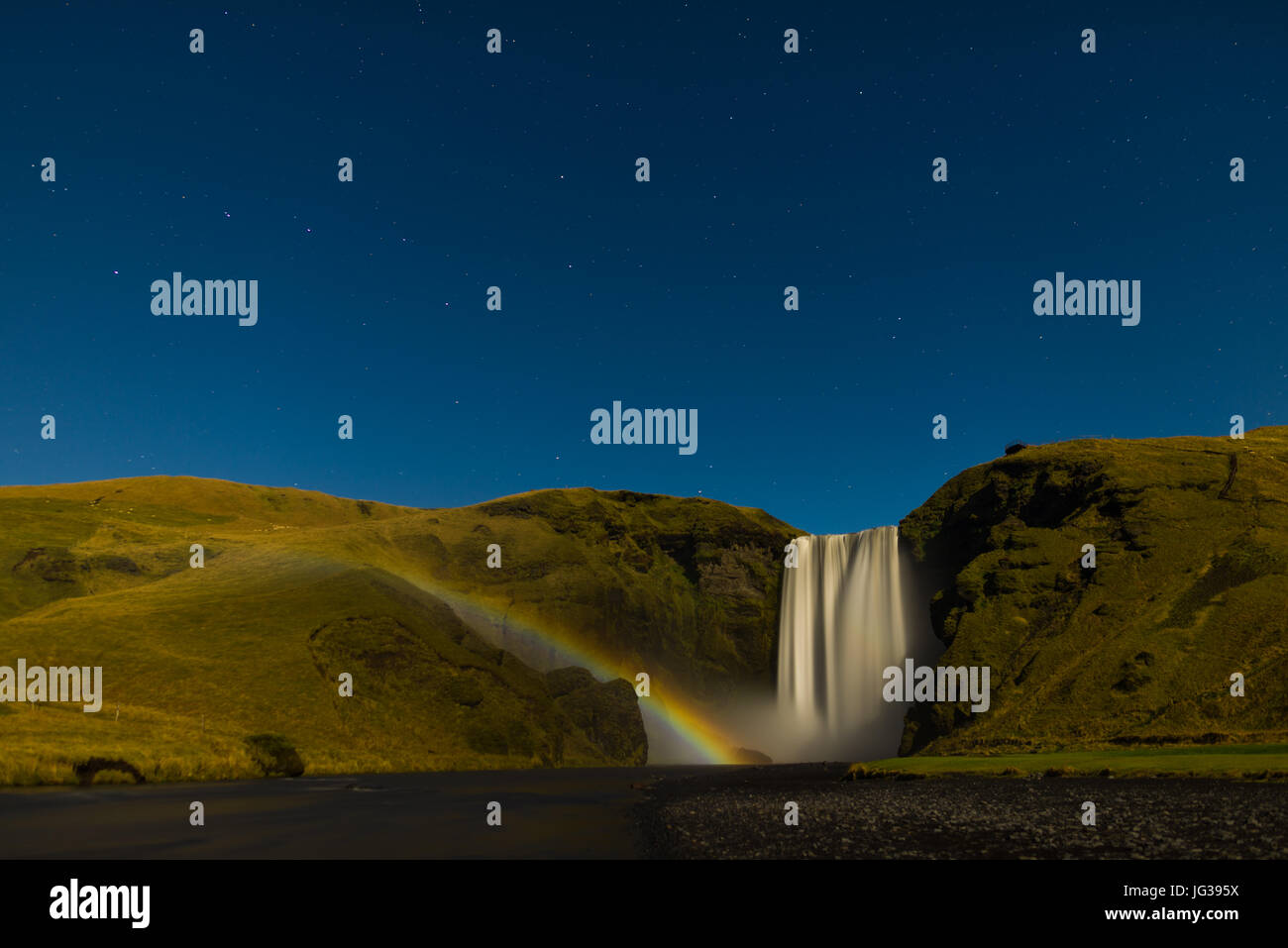 Skogafoss Waterfall At Night Lit By Moonlight Creating A Moonbow ...