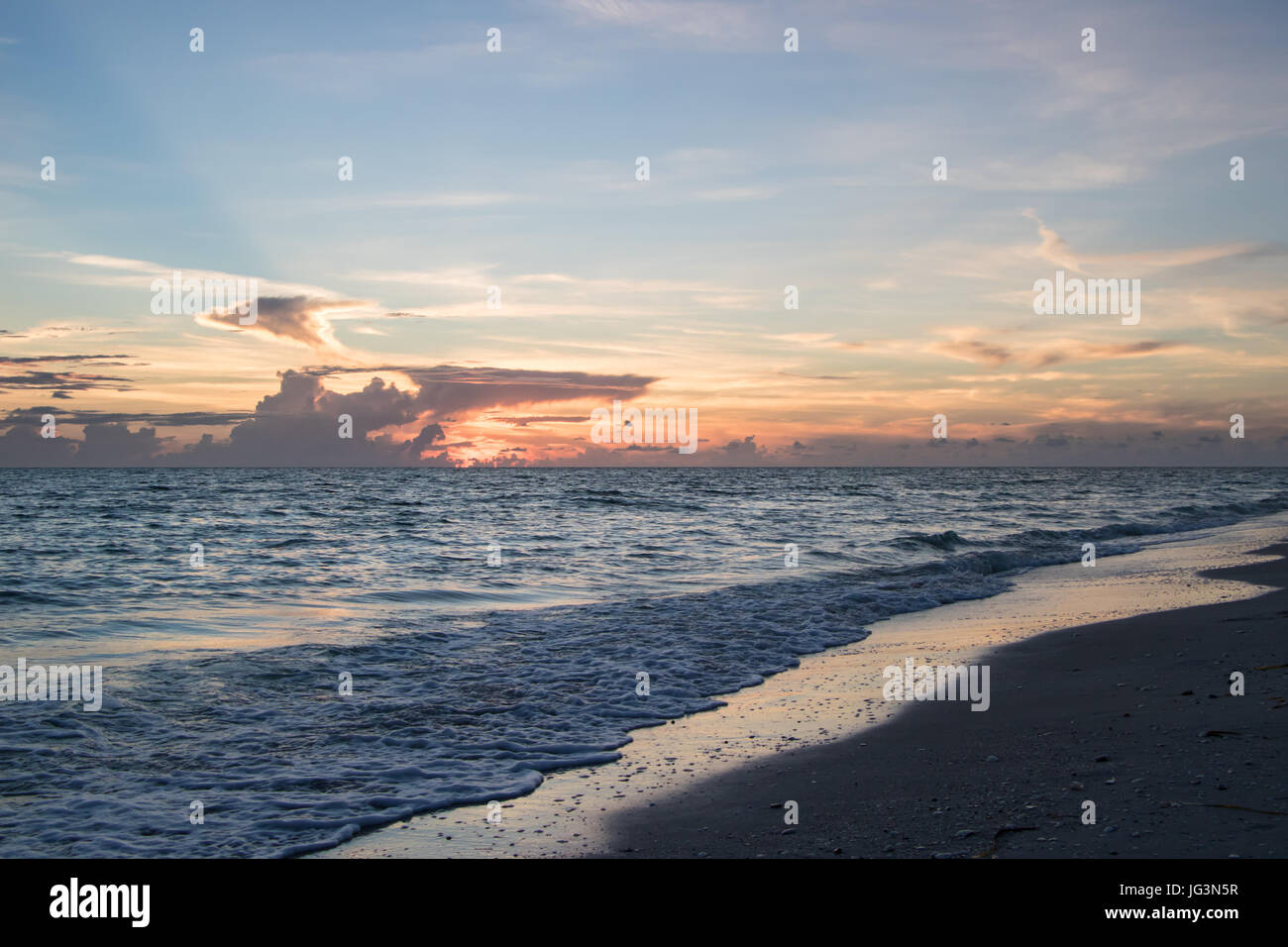 Beach at Sunset Stock Photo - Alamy