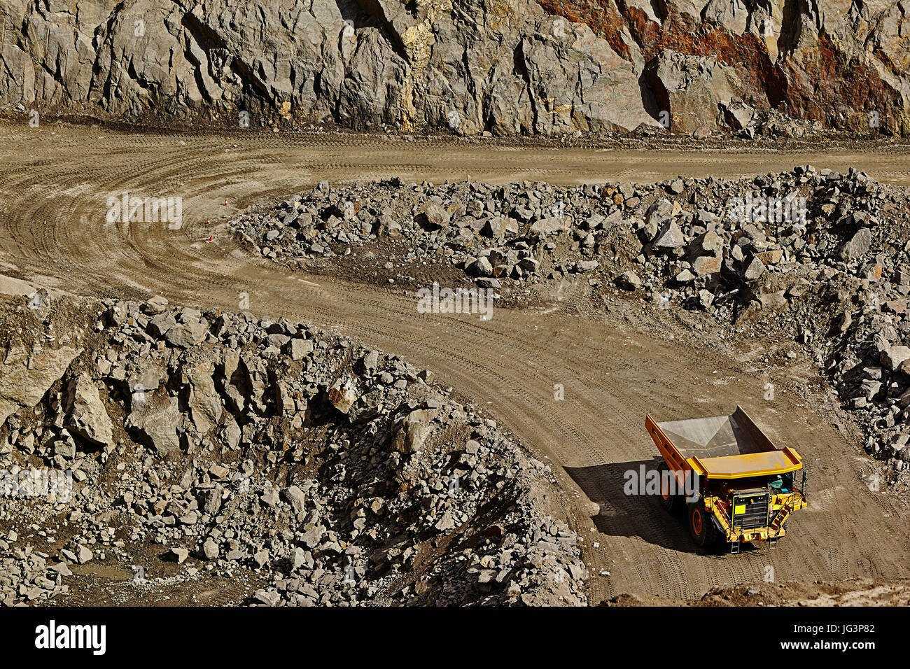 Vehicles working in open cut mine Stock Photo - Alamy
