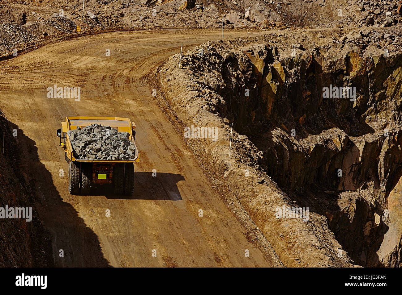 Vehicles working in open cut mine Stock Photo - Alamy
