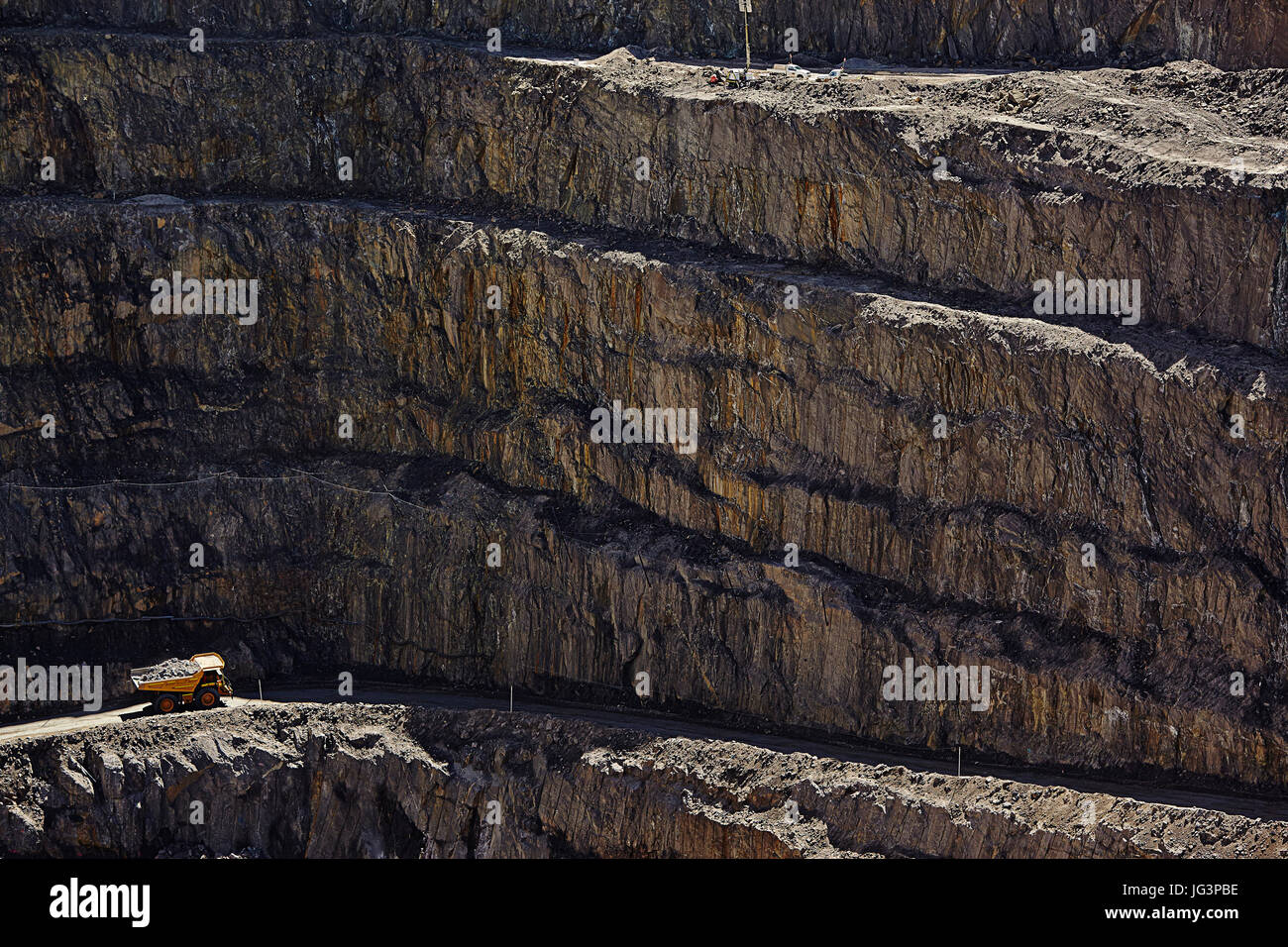 Vehicles working in open cut mine Stock Photo - Alamy