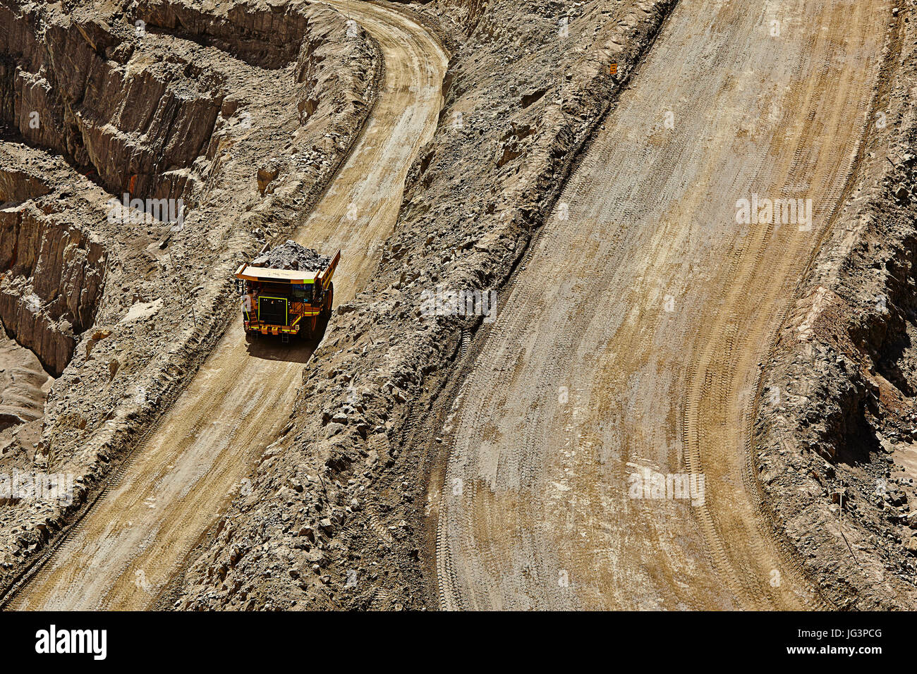 Vehicles working in open cut mine Stock Photo - Alamy