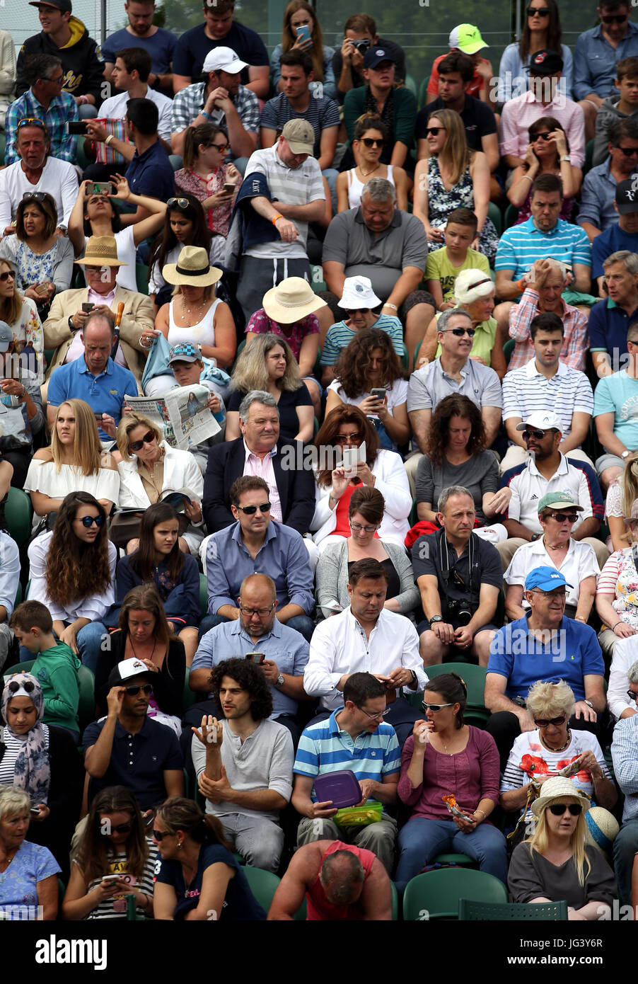 Spectators take their seats on courts ahead of play starting on day one ...